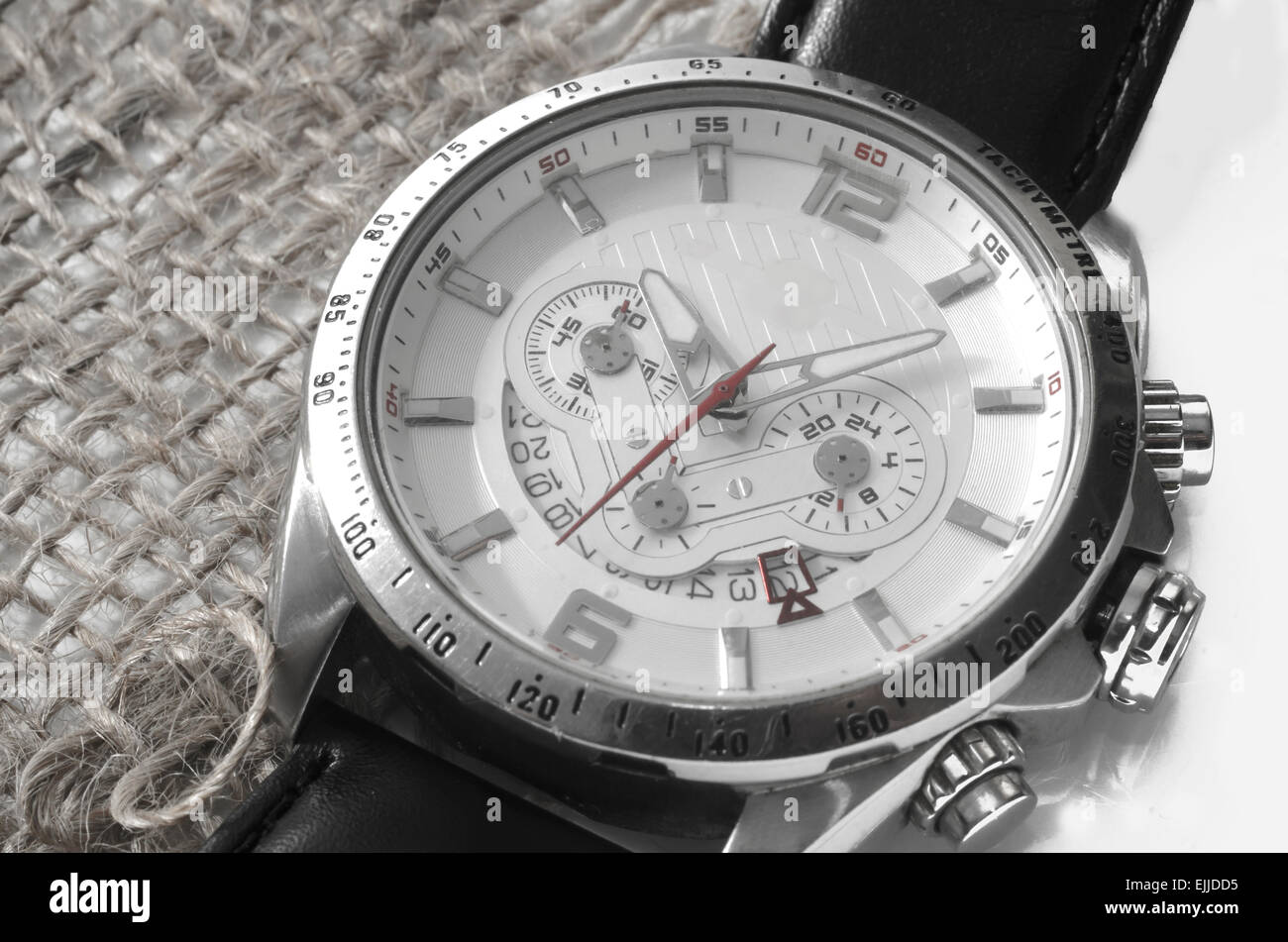 Silver watch on canvas isolated on white background Stock Photo - Alamy