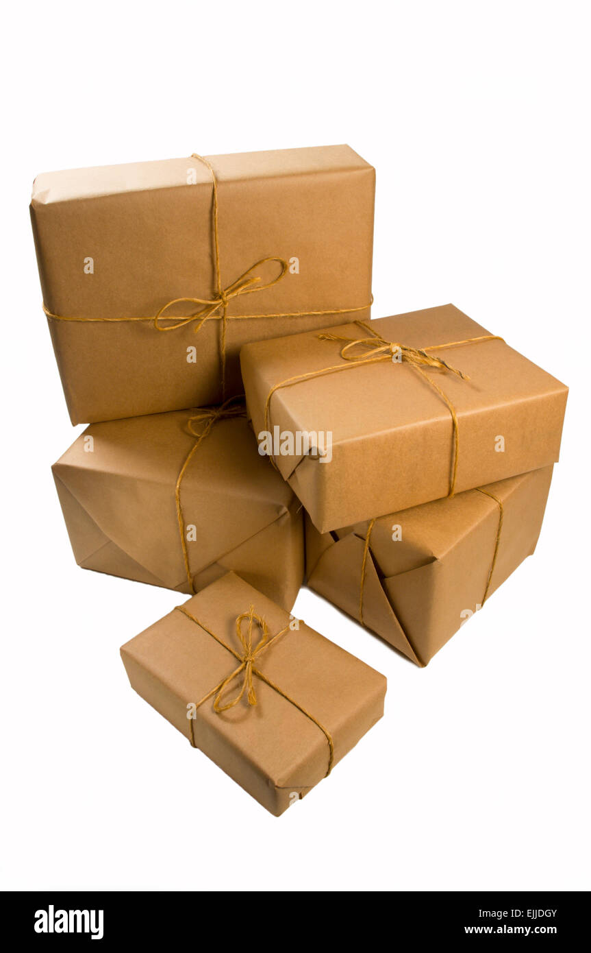 Stack of brown paper wrapped parcels for shipping Stock Photo - Alamy