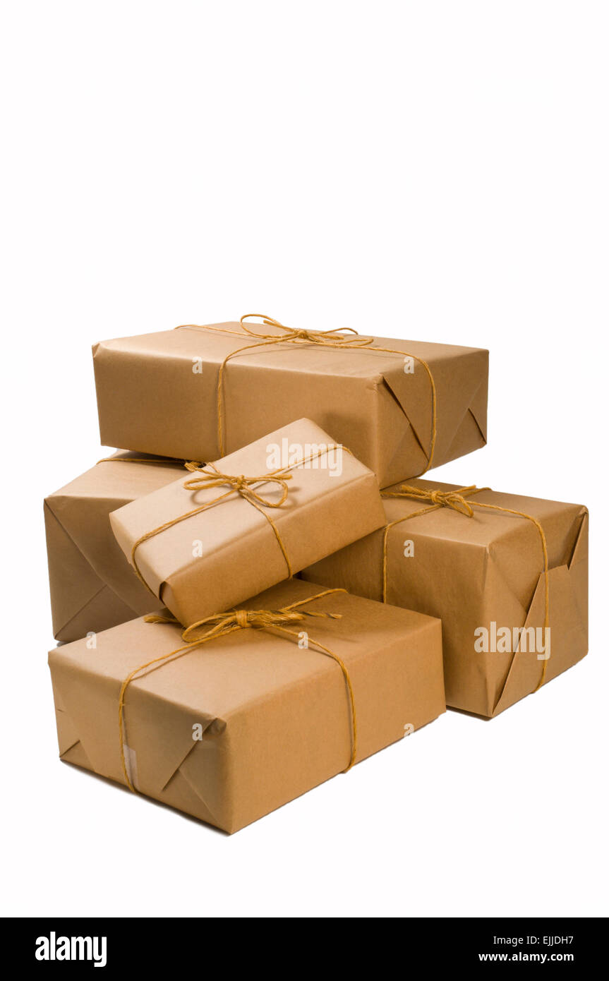 Stack of brown paper wrapped parcels for shipping Stock Photo - Alamy