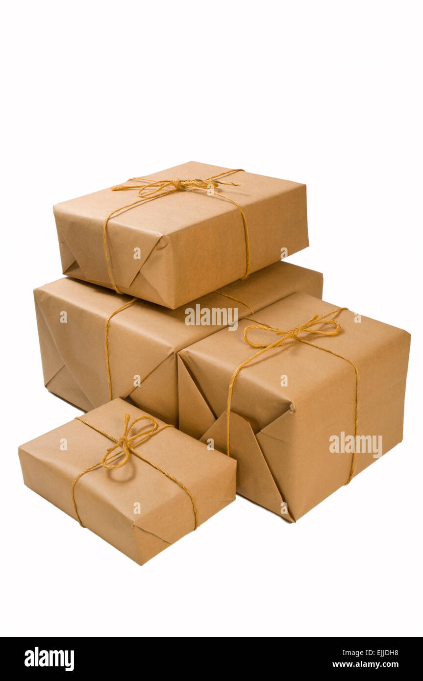 Stack of brown paper wrapped parcels for shipping Stock Photo - Alamy