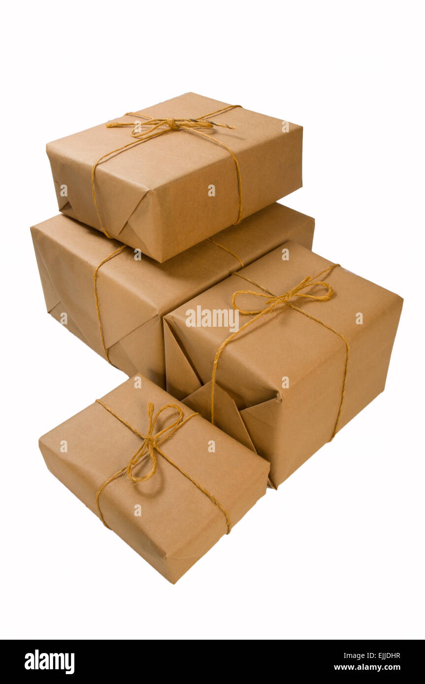 Stack of brown paper wrapped parcels for shipping Stock Photo - Alamy
