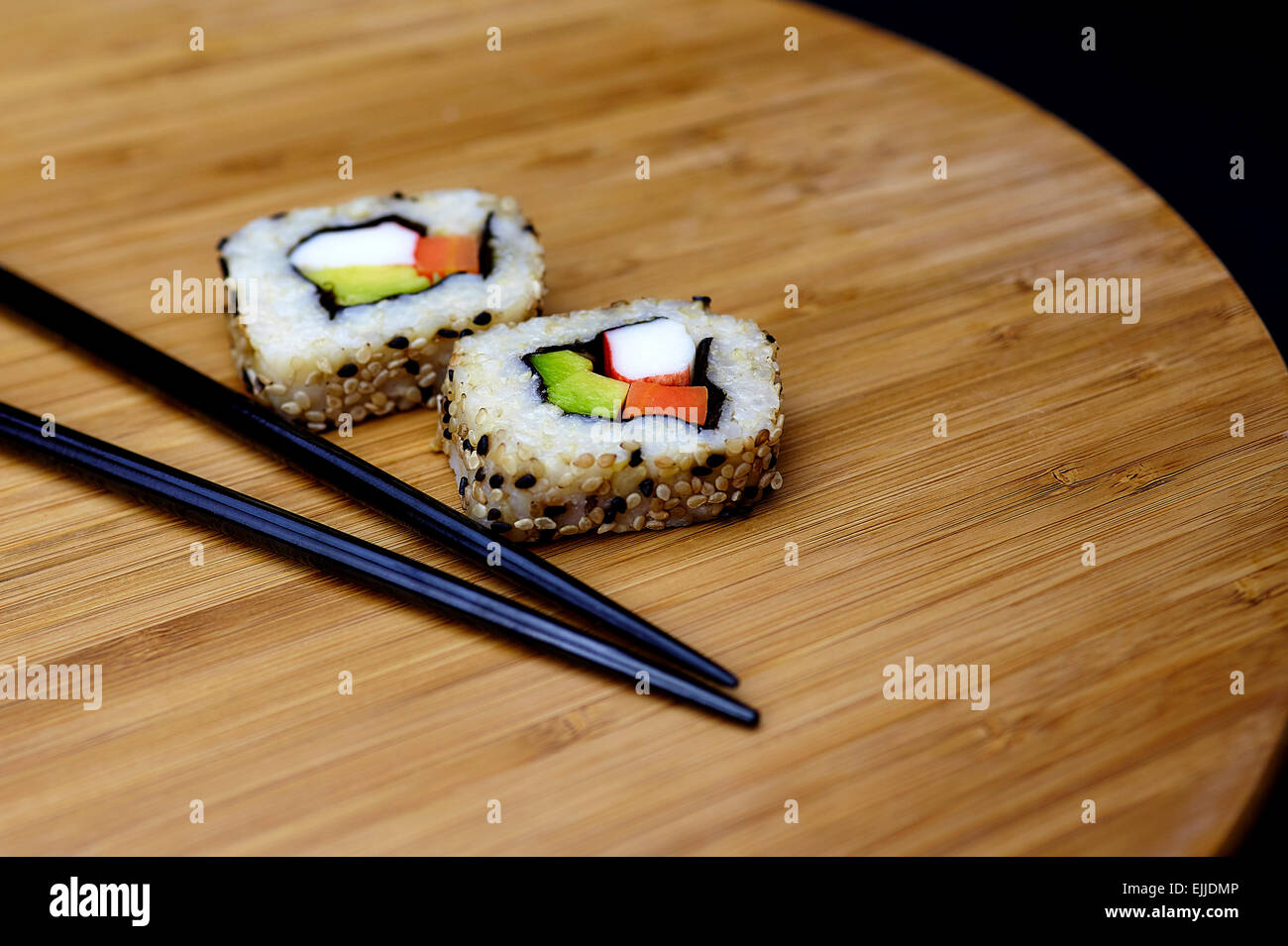 Brown Rice Sushi wrapped with nori, avocado, salmon, white fish and ...