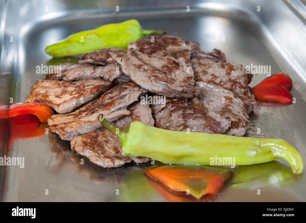 Closeup of beef steak slices in tray at a hotel restaurant buffet ...