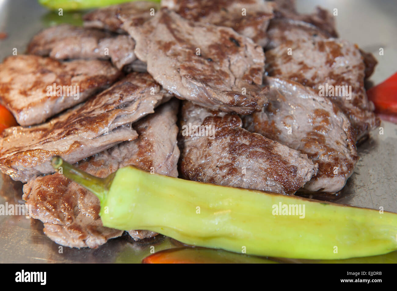 Closeup of beef steak slices in tray at a hotel restaurant buffet ...