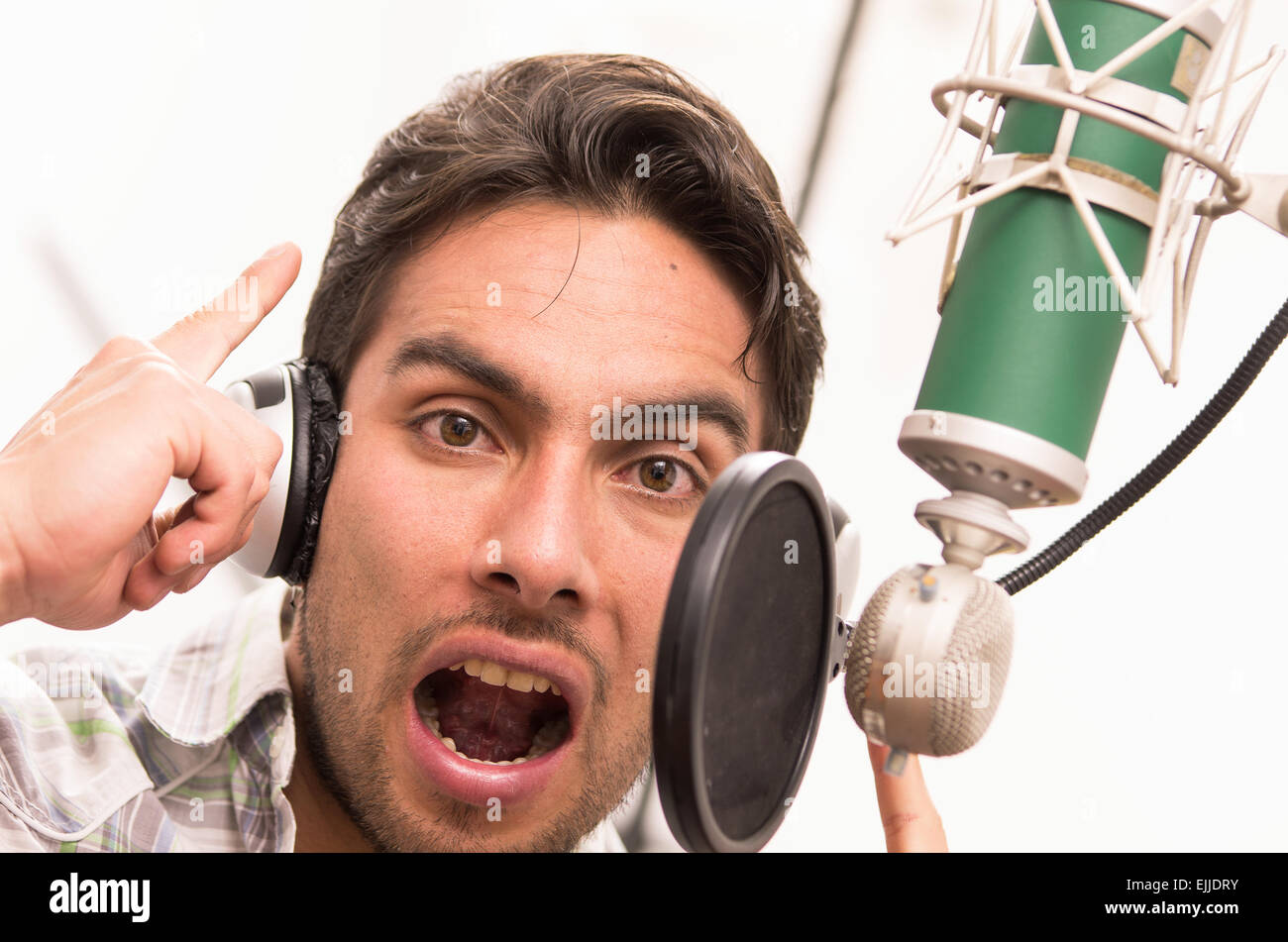 Joyful man singing in microphone hi-res stock photography and images ...