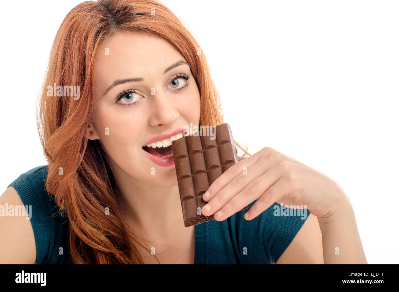 Happy woman eating a yummy chocolate and having some sugar for an ...