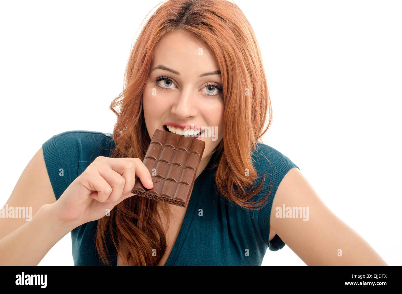 Happy woman eating a yummy chocolate and having some sugar for an ...
