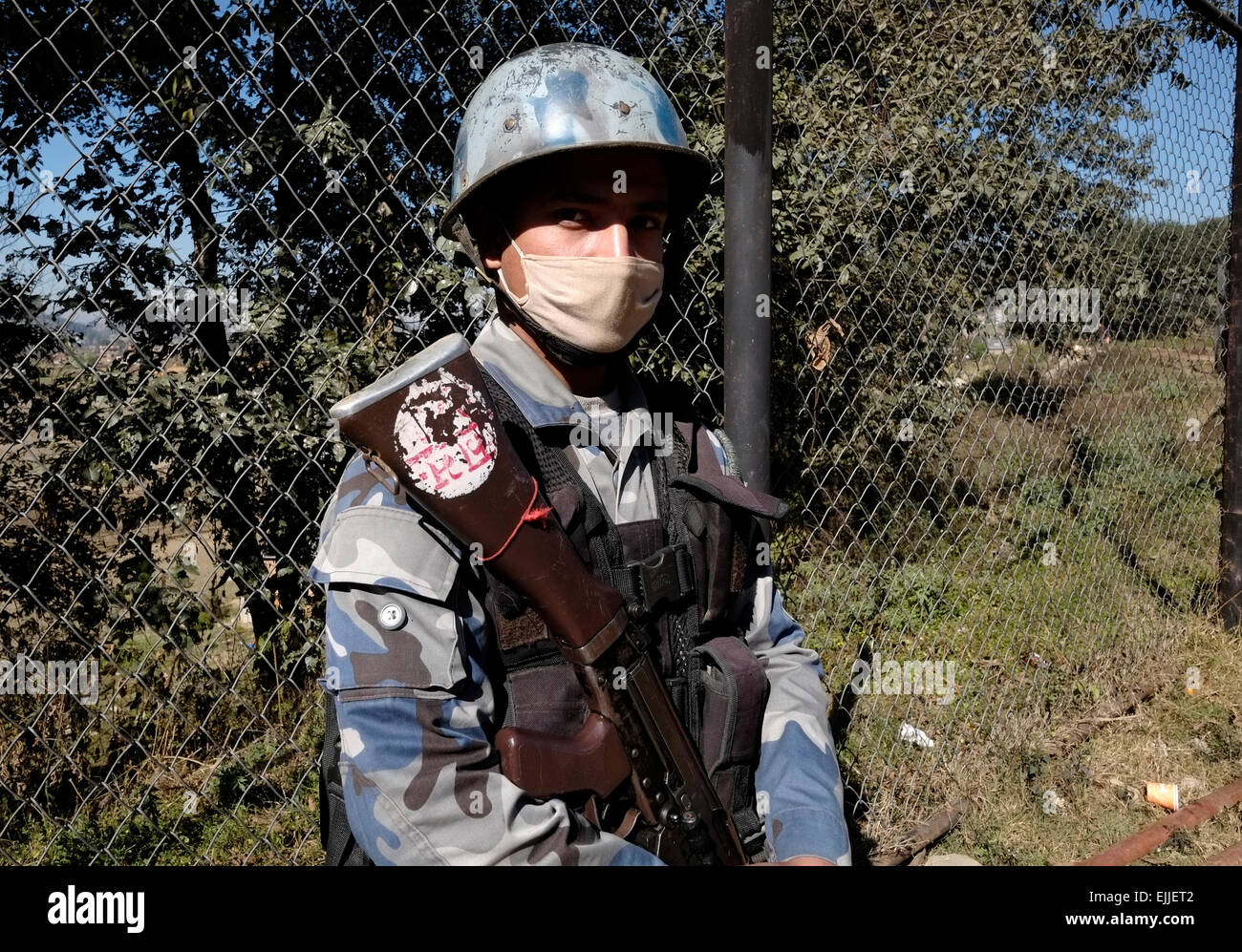 An armed Nepalese soldier stands guard in the town of Dhulikhel in ...