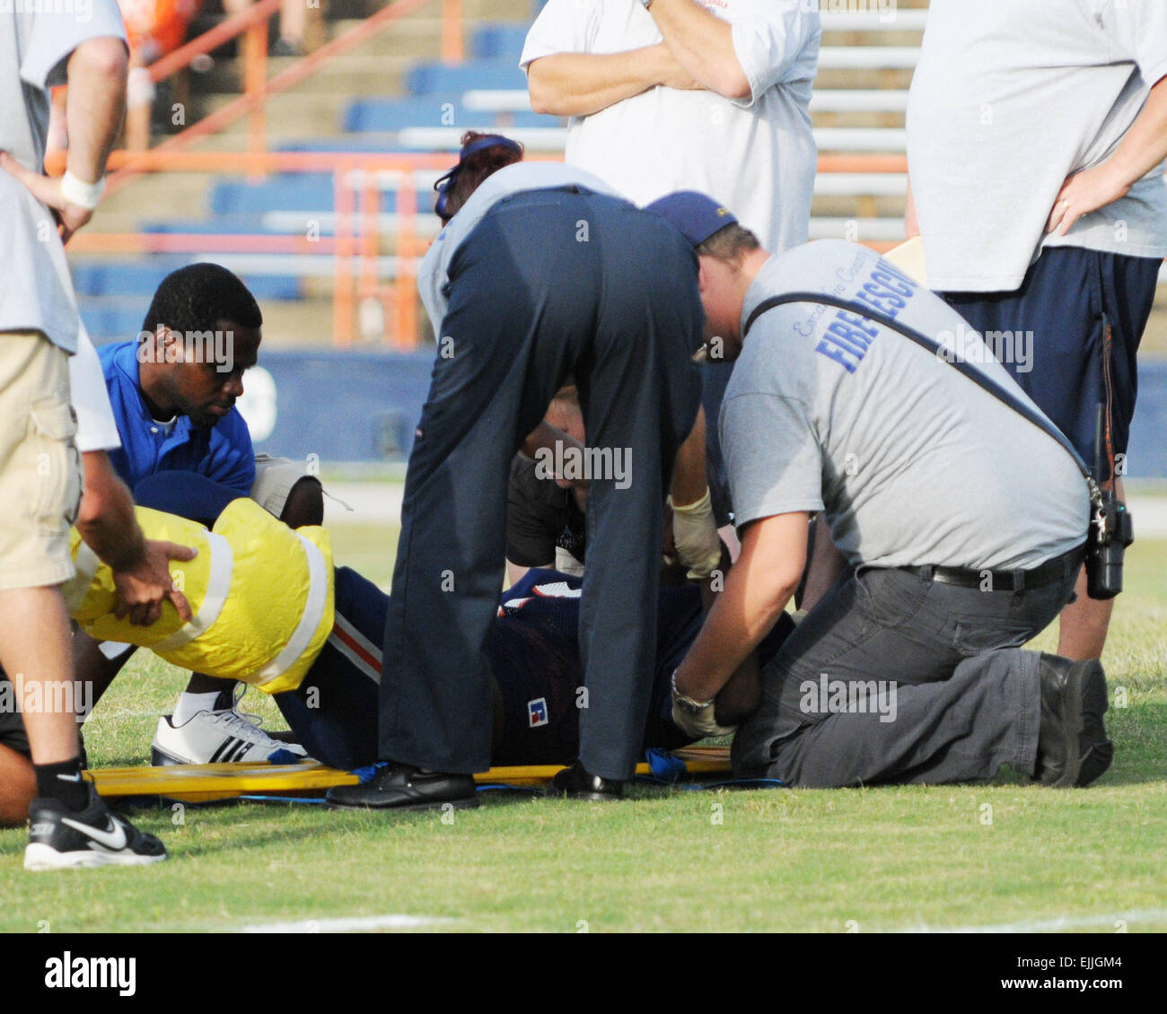 Medical personnel tend to injured field football on the field Stock ...