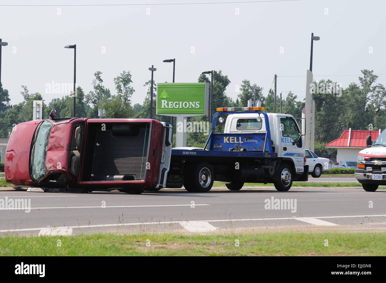 Overturned vehicle being uprighted by tow truck Stock Photo - Alamy