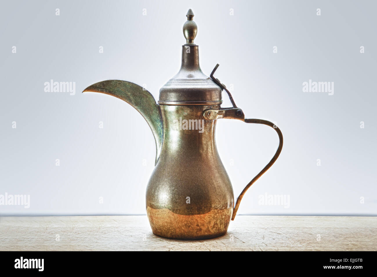 Old traditional arabic pitcher isolated over white background, placed ...