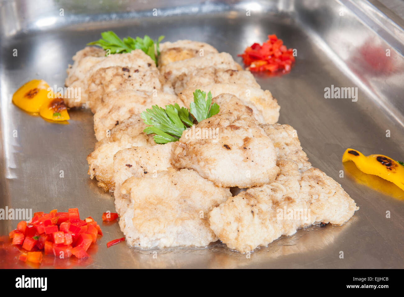 Slices of grilled fish on display at a hotel restaurant buffet Stock ...