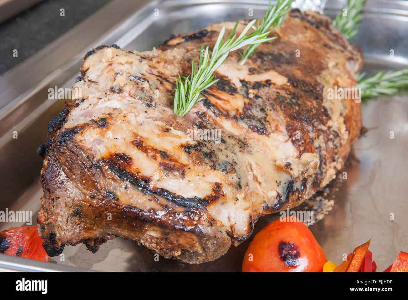 Whole leg of roast lamb on display at a hotel restaurant buffet Stock ...