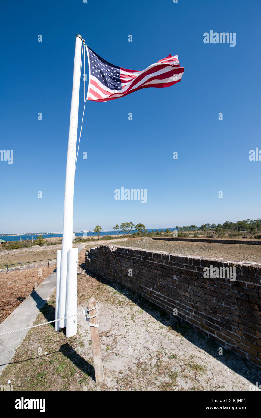 Flag flying over historic Fort Pickens on Santa Rosa Island in ...