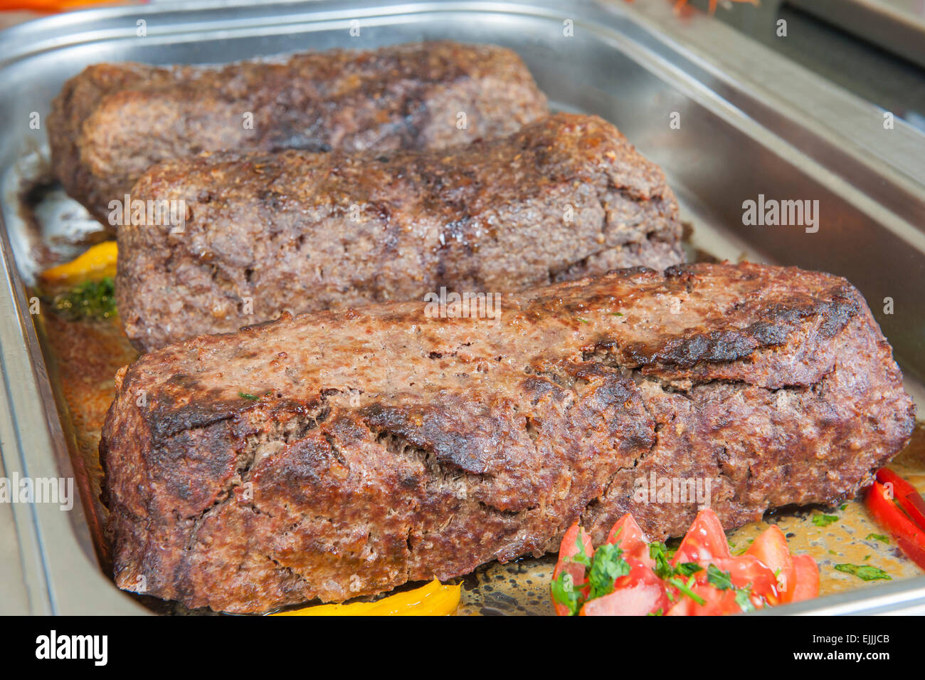 Minced beef in onion sauce meatloaf on display at a hotel restaurant ...