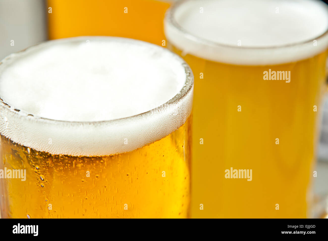 Three glasses of fresh and foamy beer just served Stock Photo - Alamy