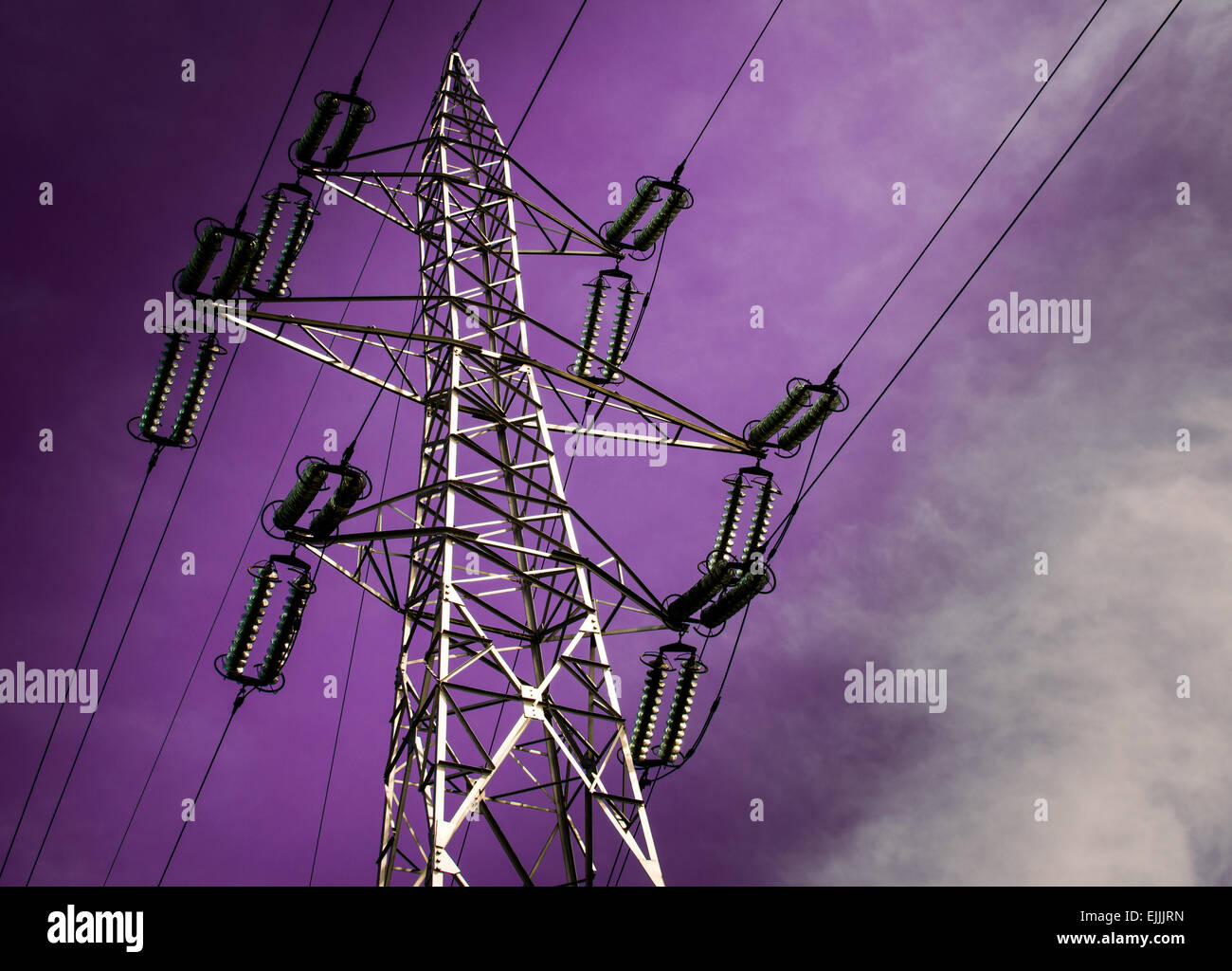 Electricity pole with purple sky Stock Photo - Alamy