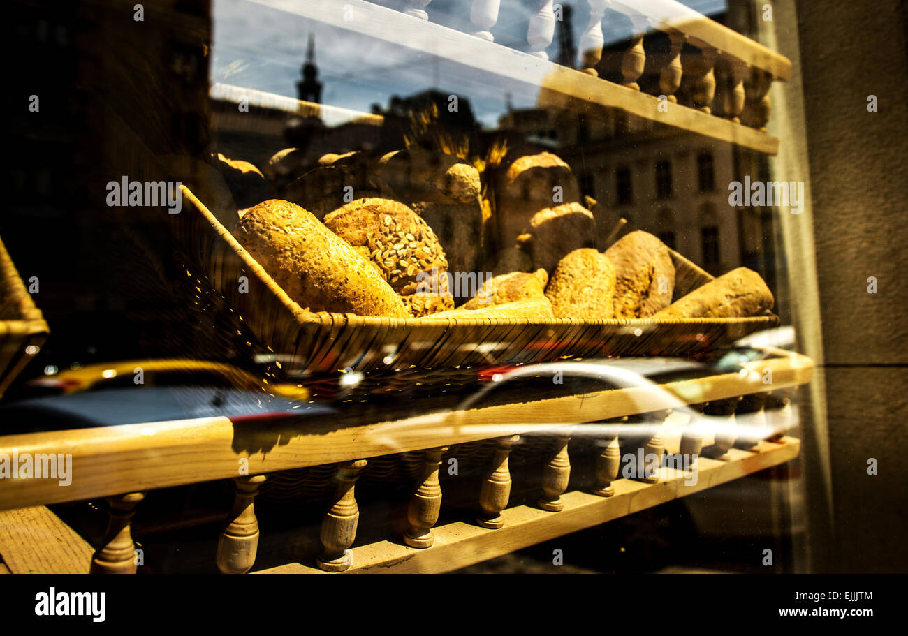 Bakery window with a bread basket and city reflection Stock Photo - Alamy