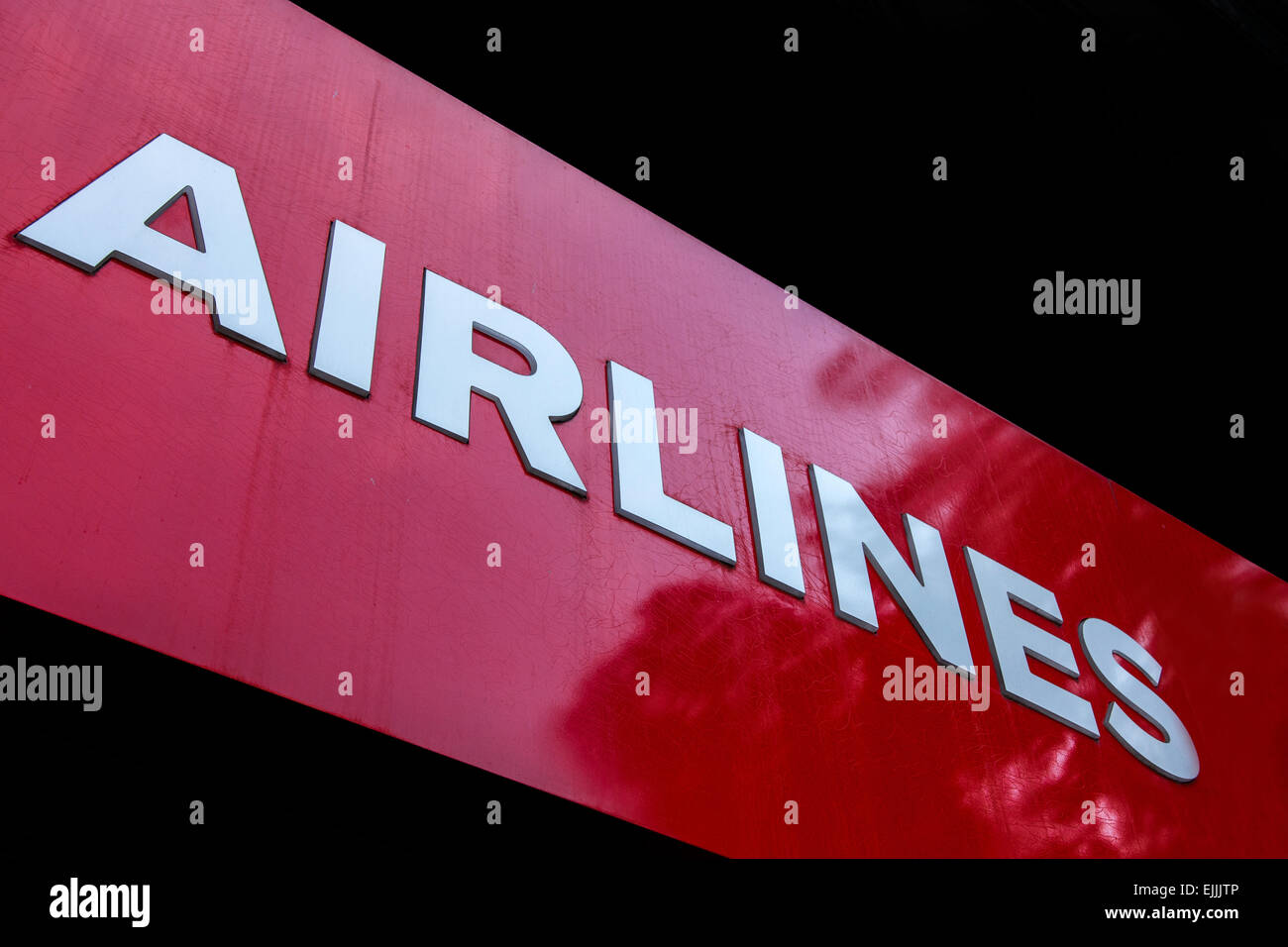 Airlines text written with white on red background Stock Photo - Alamy