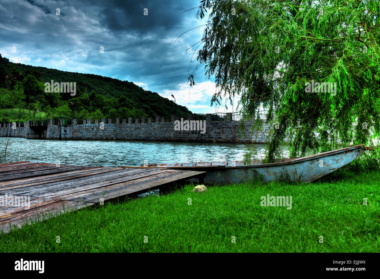 Boat at shore of lake, by the pontoon Stock Photo - Alamy