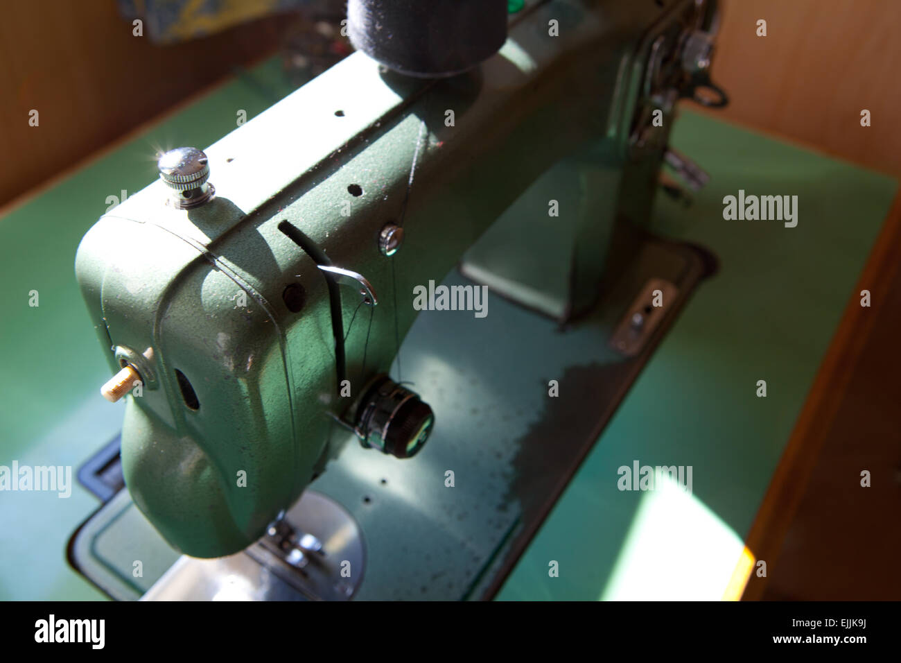 Old green electrical sewing machine at daylight Stock Photo - Alamy