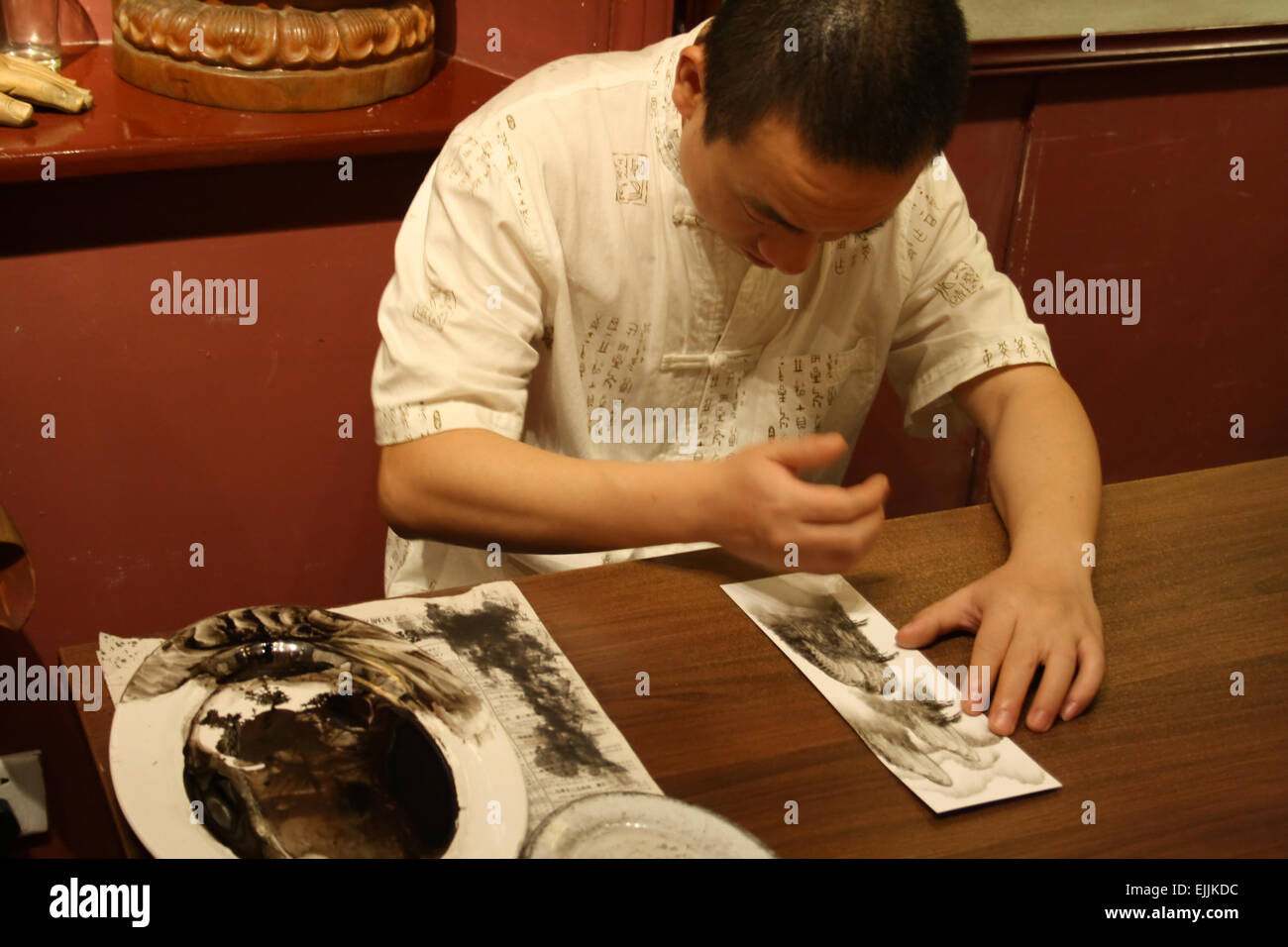 original art - printing on paper, fold thumb Stock Photo - Alamy