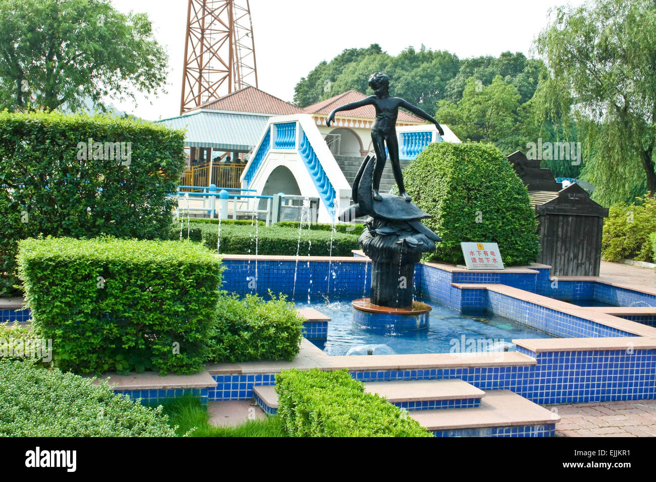 boy on a turtle - a fountain in an amusement park Stock Photo - Alamy