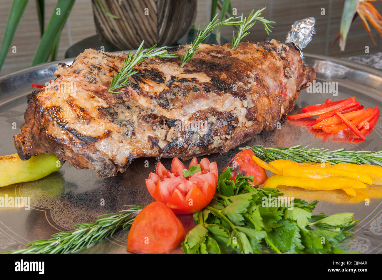 Whole roasted leg of lamb on display at a hotel restaurant buffet Stock ...