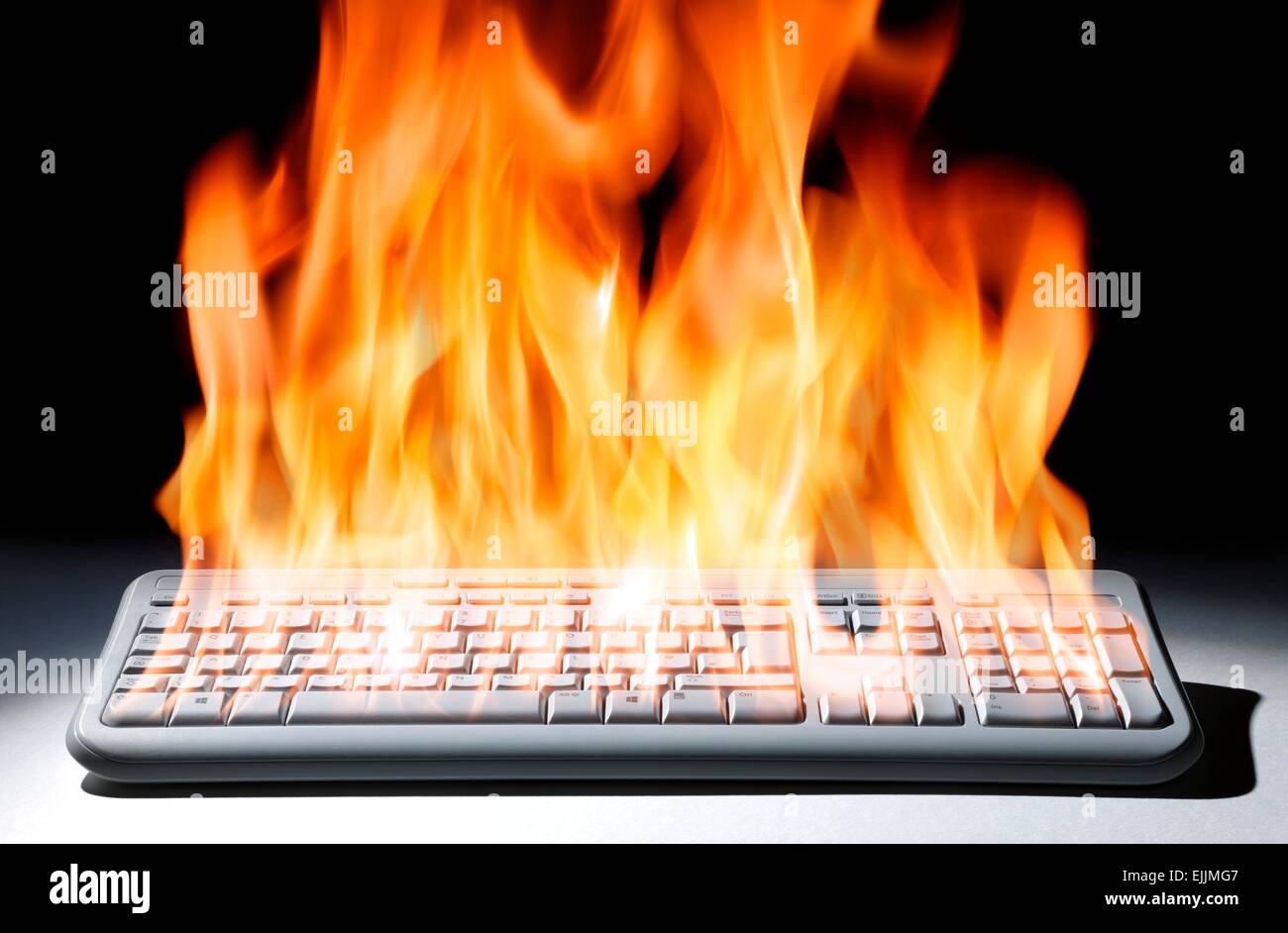 Computer keyboard in flames, computer artwork Stock Photo - Alamy