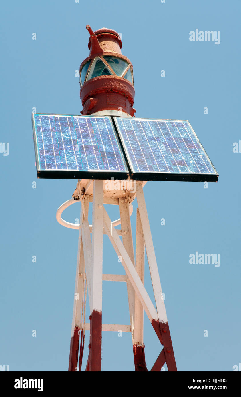 Solar powered harbour light Stock Photo - Alamy