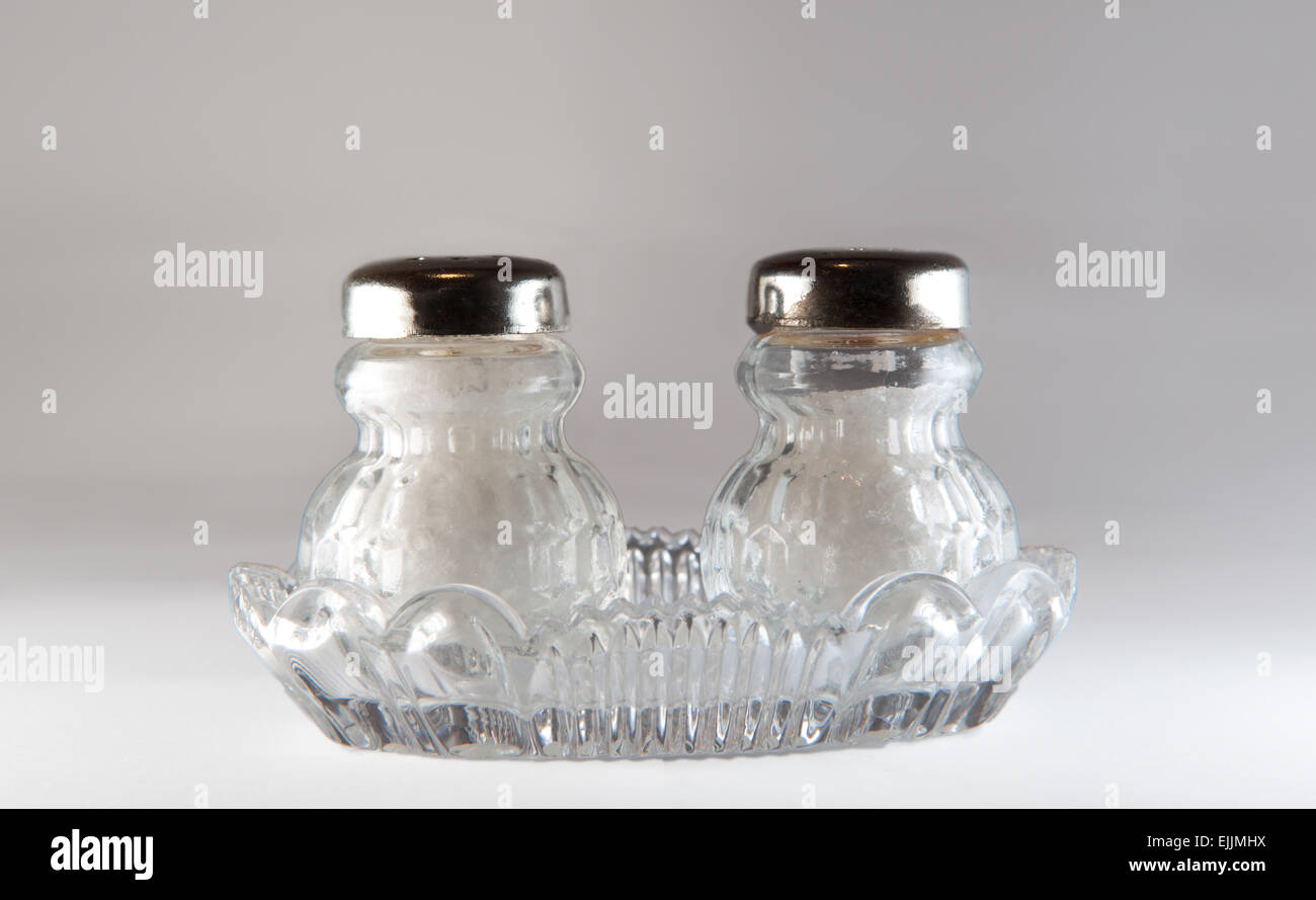 Front view of a set of two salt shakers isolated on white background ...