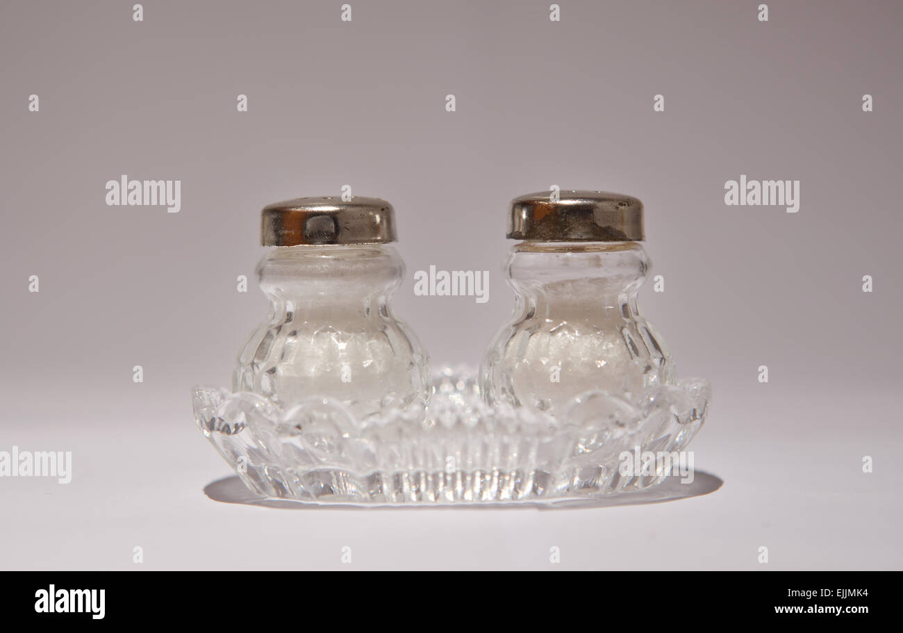 Front view of a set of two salt shakers isolated on white background ...
