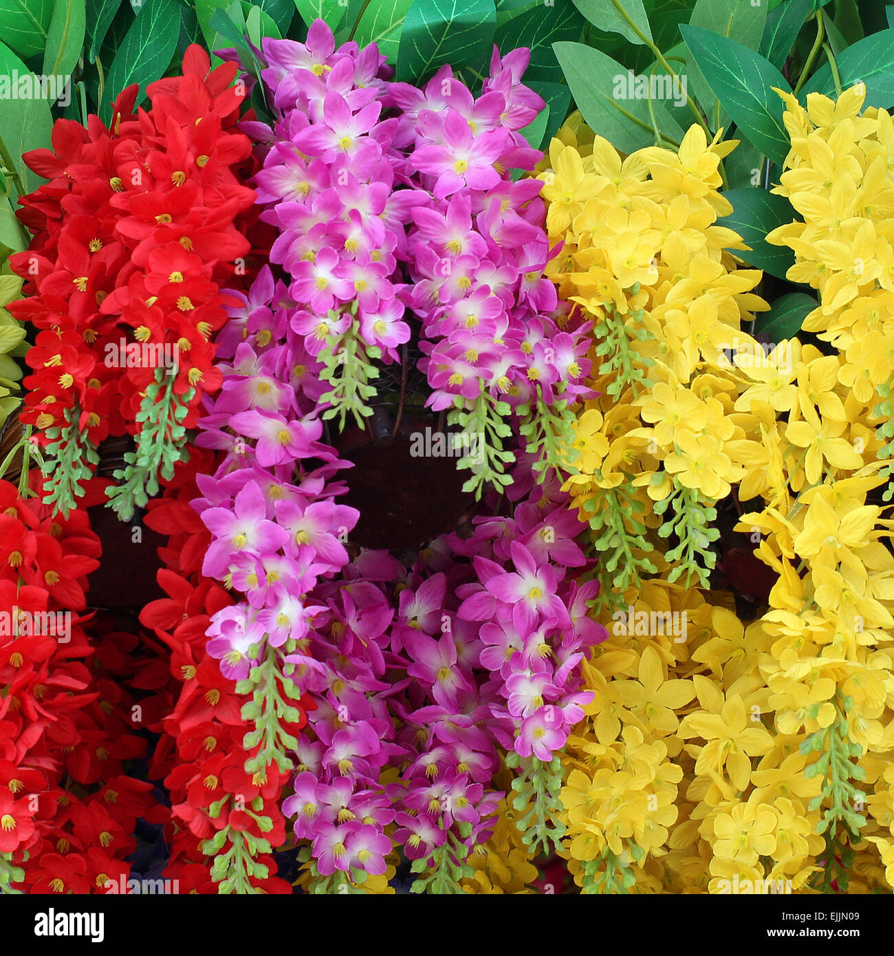 Colorful of decoration artificial flower Stock Photo - Alamy