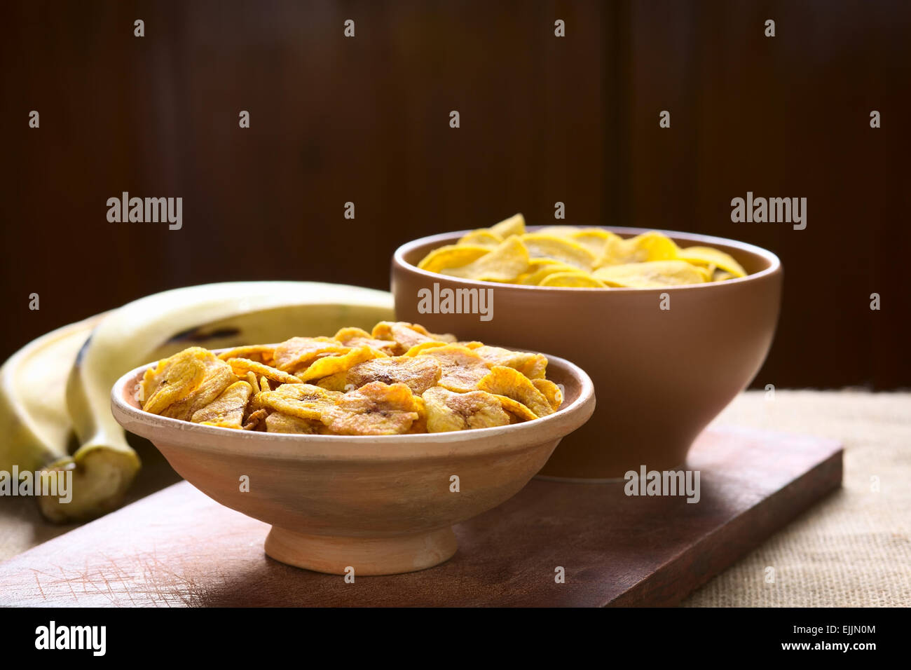 Bowls of sweet (front) and salty (back) plantain chips, a popular snack ...
