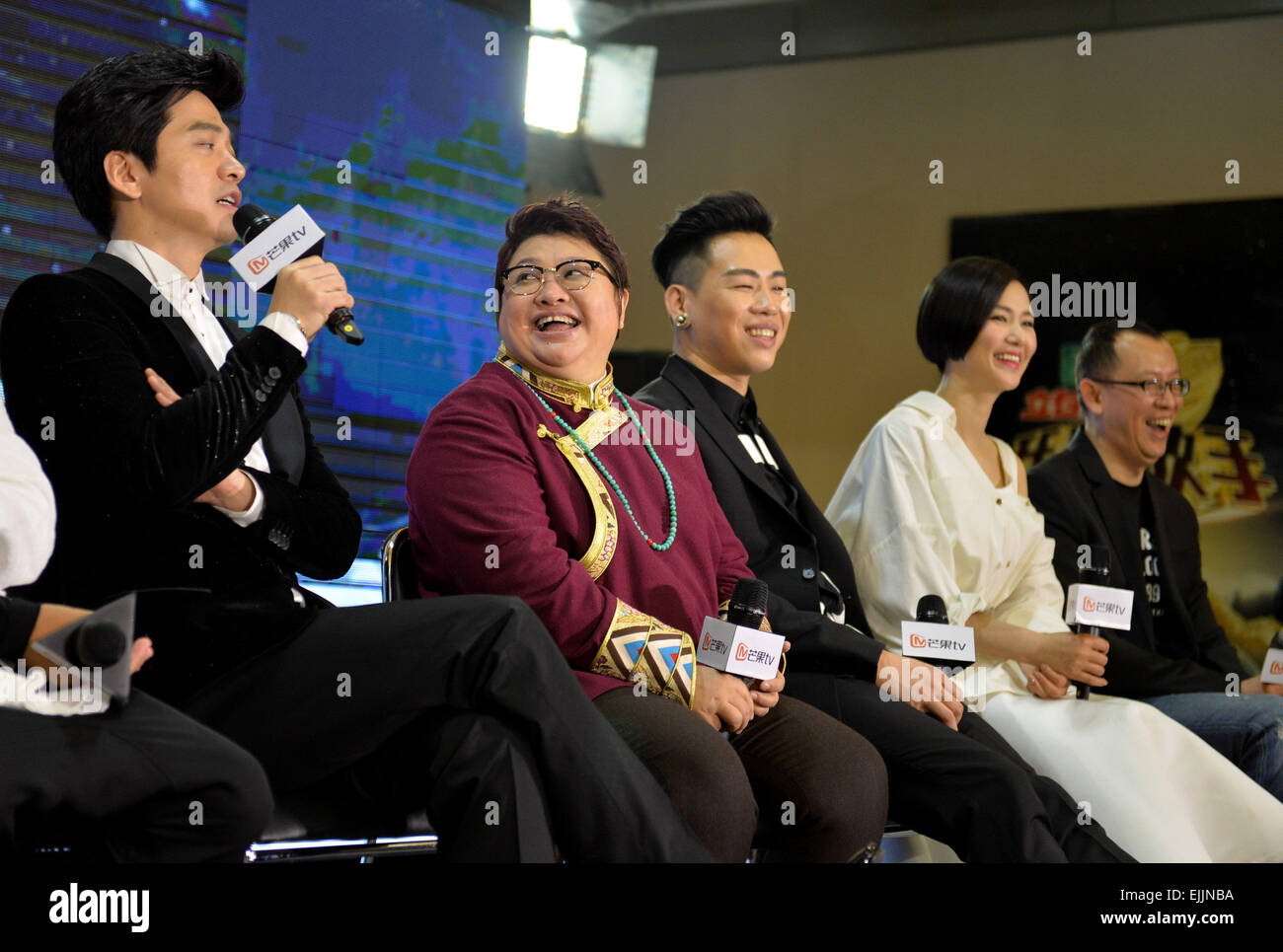 Changsha. 28th Mar, 2015. Singer Li Jian (1st L) answers questions at ...