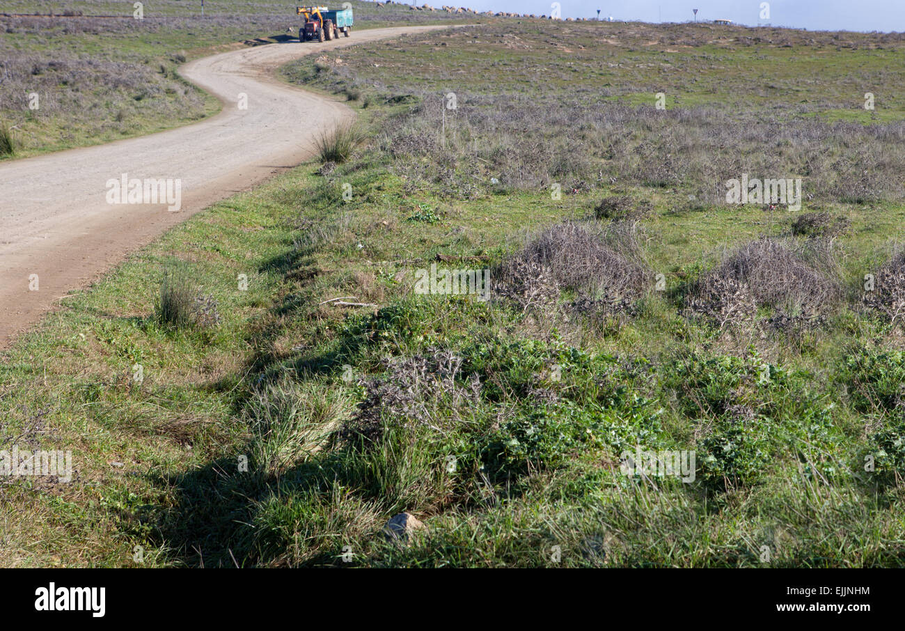 Tractor with trailer loaded running through countryside ways Stock ...