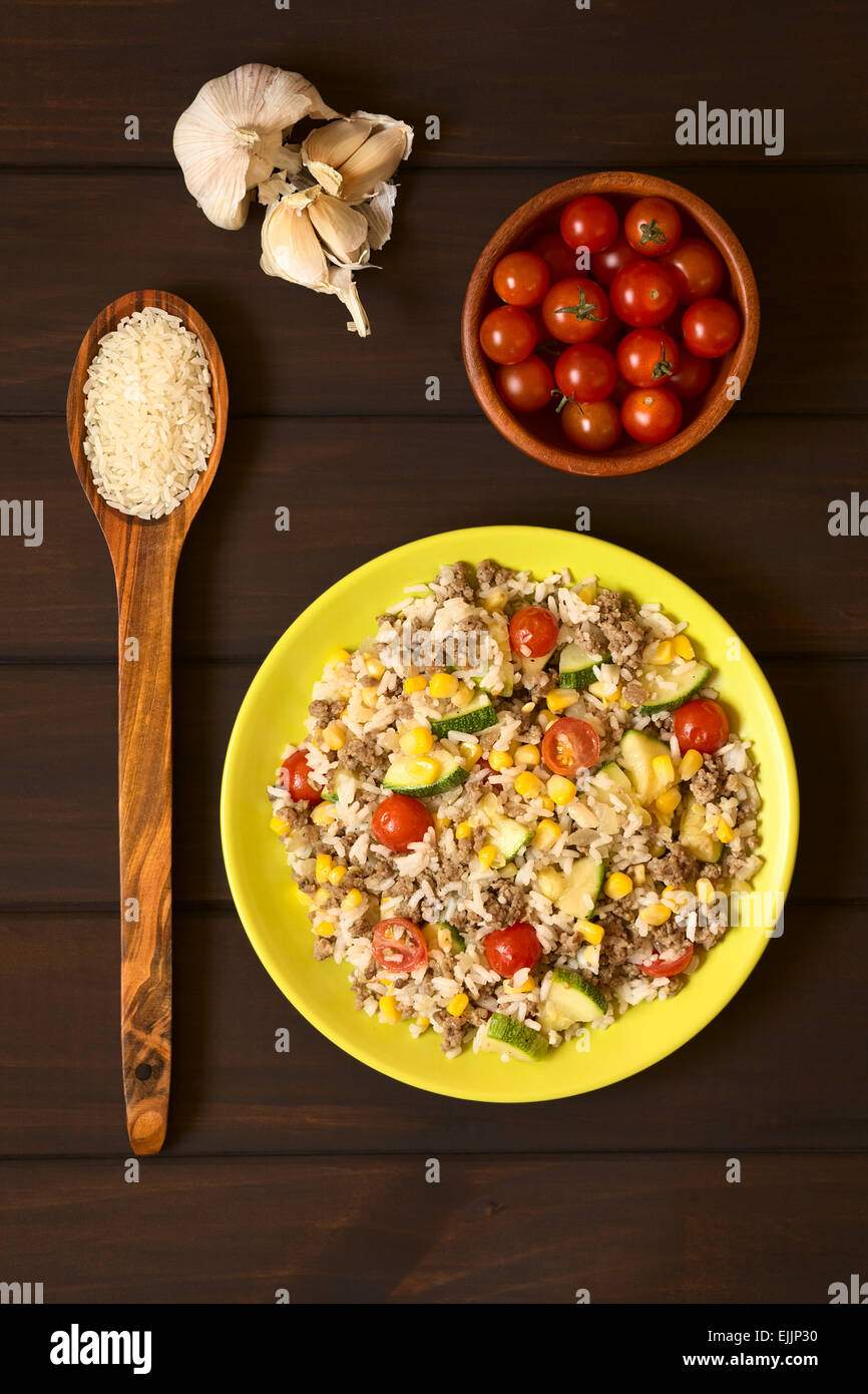 Overhead shot of rice dish with mincemeat and vegetables (sweet corn ...