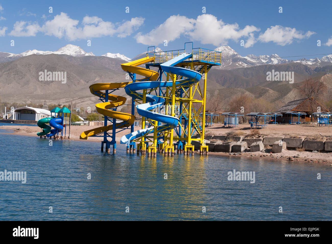 Water slide on the beach at Issyk-Kul Lake in the spring. Cholpon-Ata ...