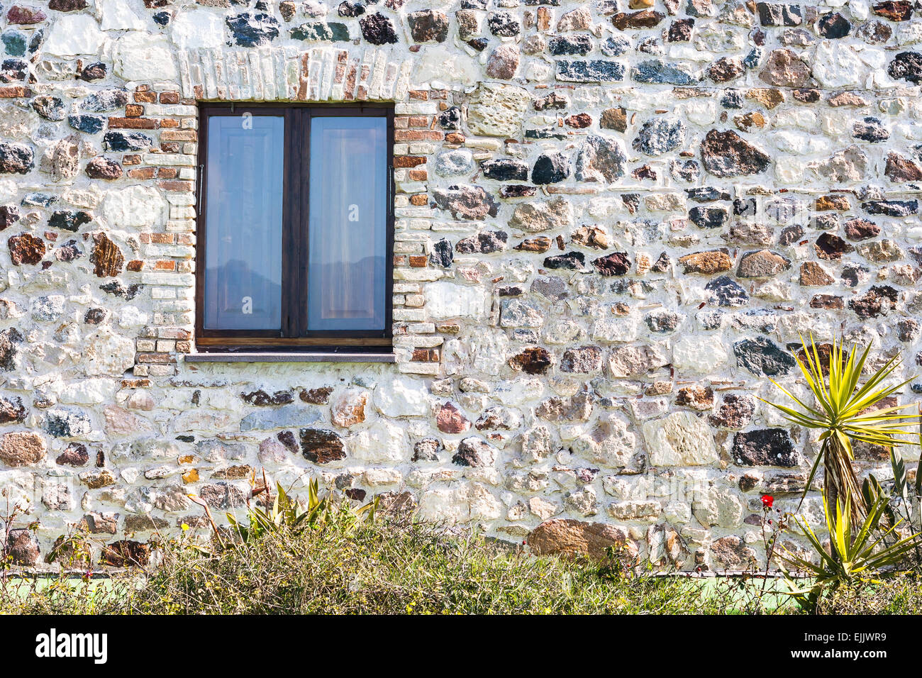 stone wall with window. particular of a stone house Stock Photo - Alamy
