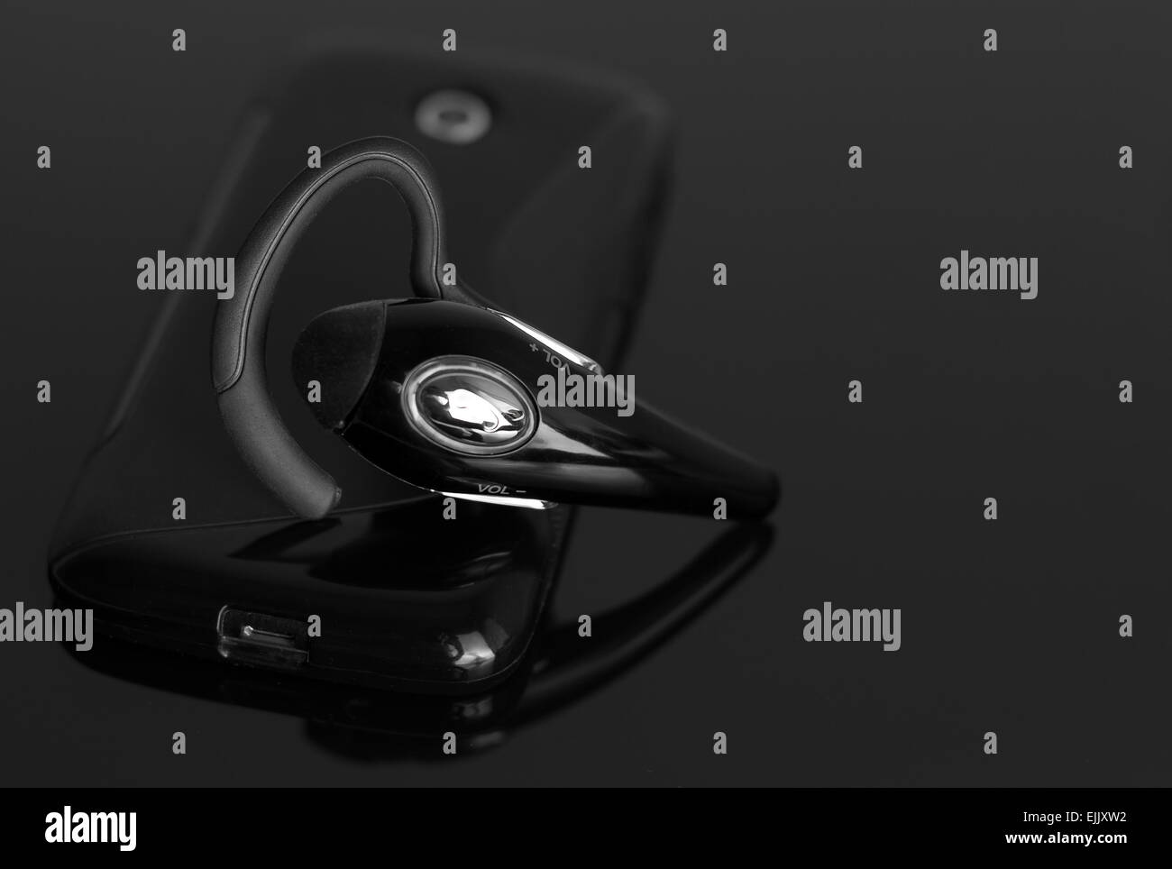 Close-up of mobile handsfree bluetooth device Stock Photo - Alamy