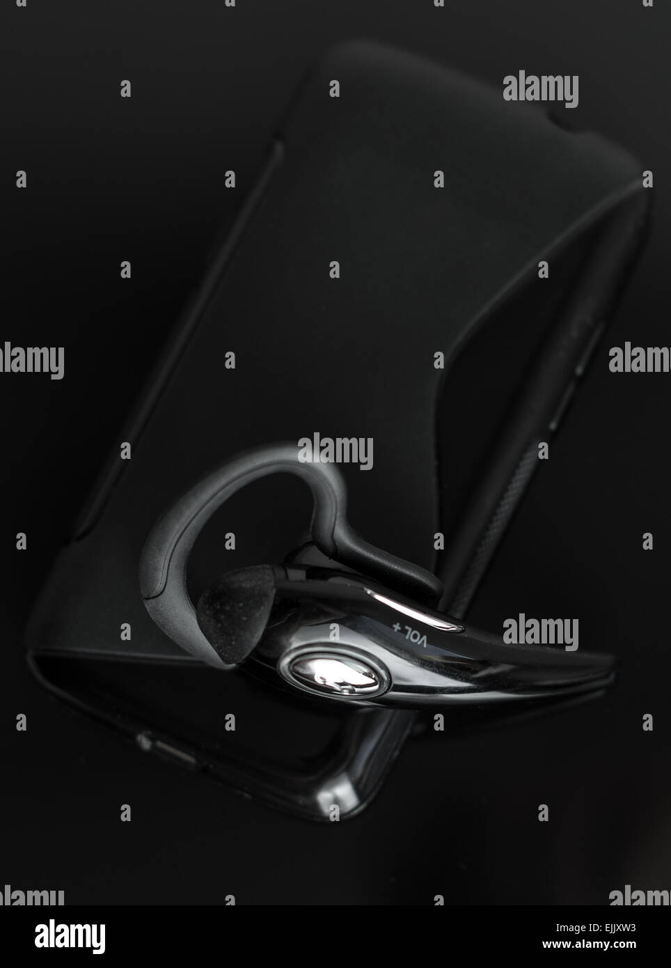 Close-up of mobile handsfree bluetooth device Stock Photo - Alamy