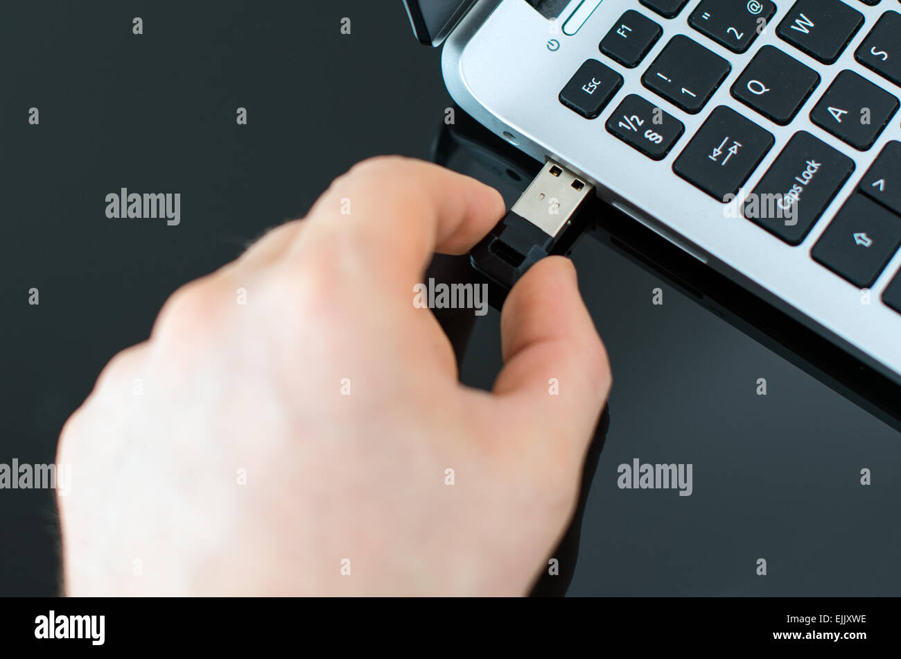 Plugging usb stick hi-res stock photography and images - Alamy