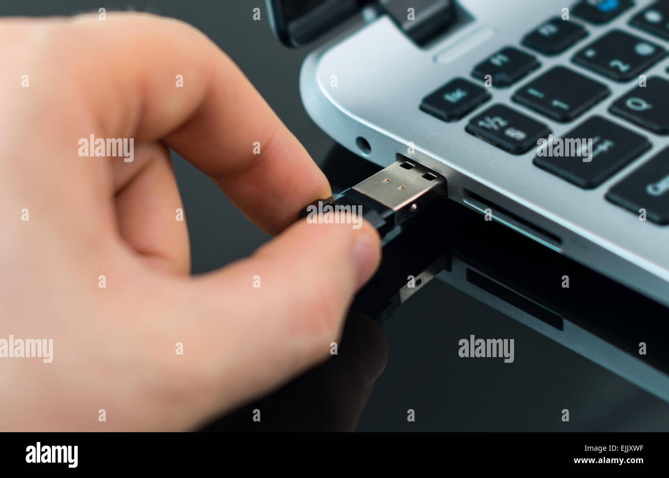 Plugging usb stick hi-res stock photography and images - Alamy