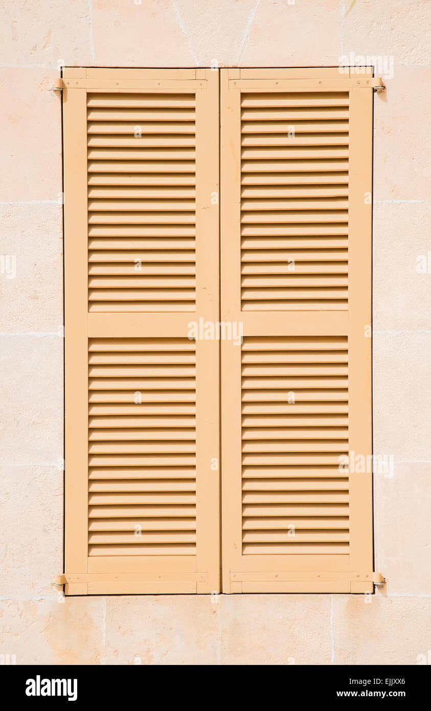 Window with beige shutters. Close-up view Stock Photo - Alamy