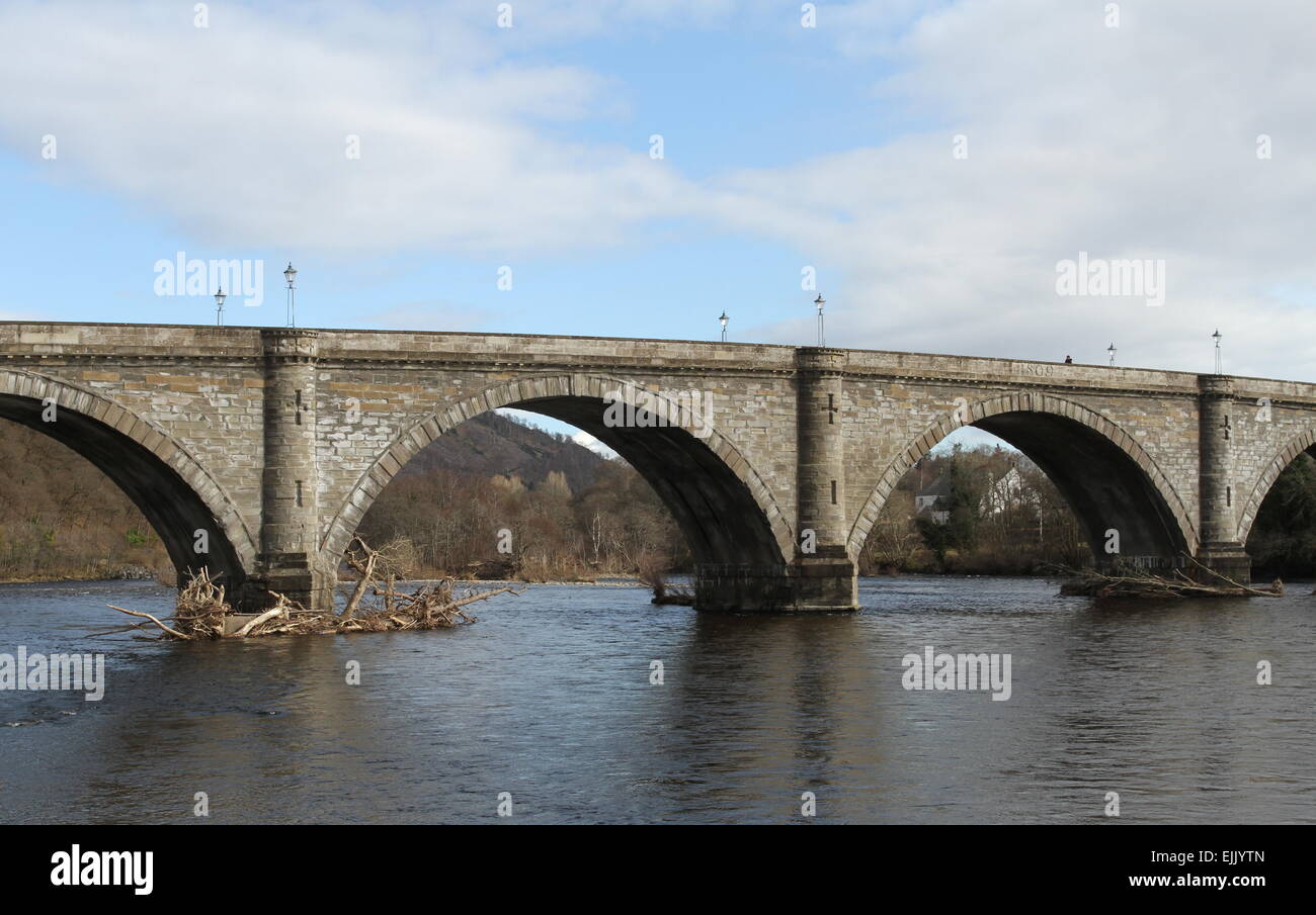 Tree and branches stuck against Dunkeld Bridge over River Tay Scotland ...