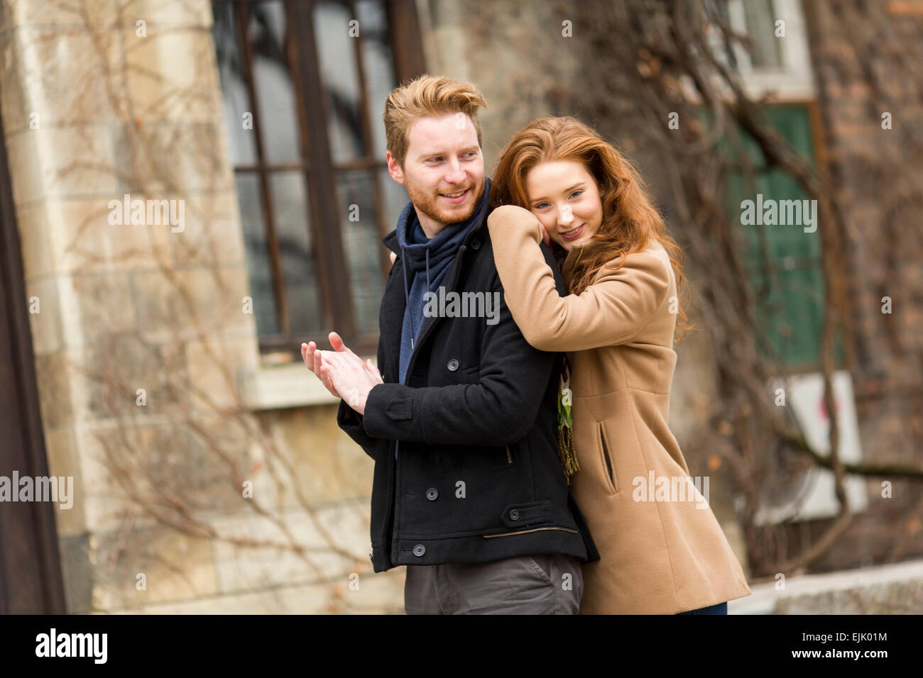 Young red hair couple at autumn park Stock Photo - Alamy