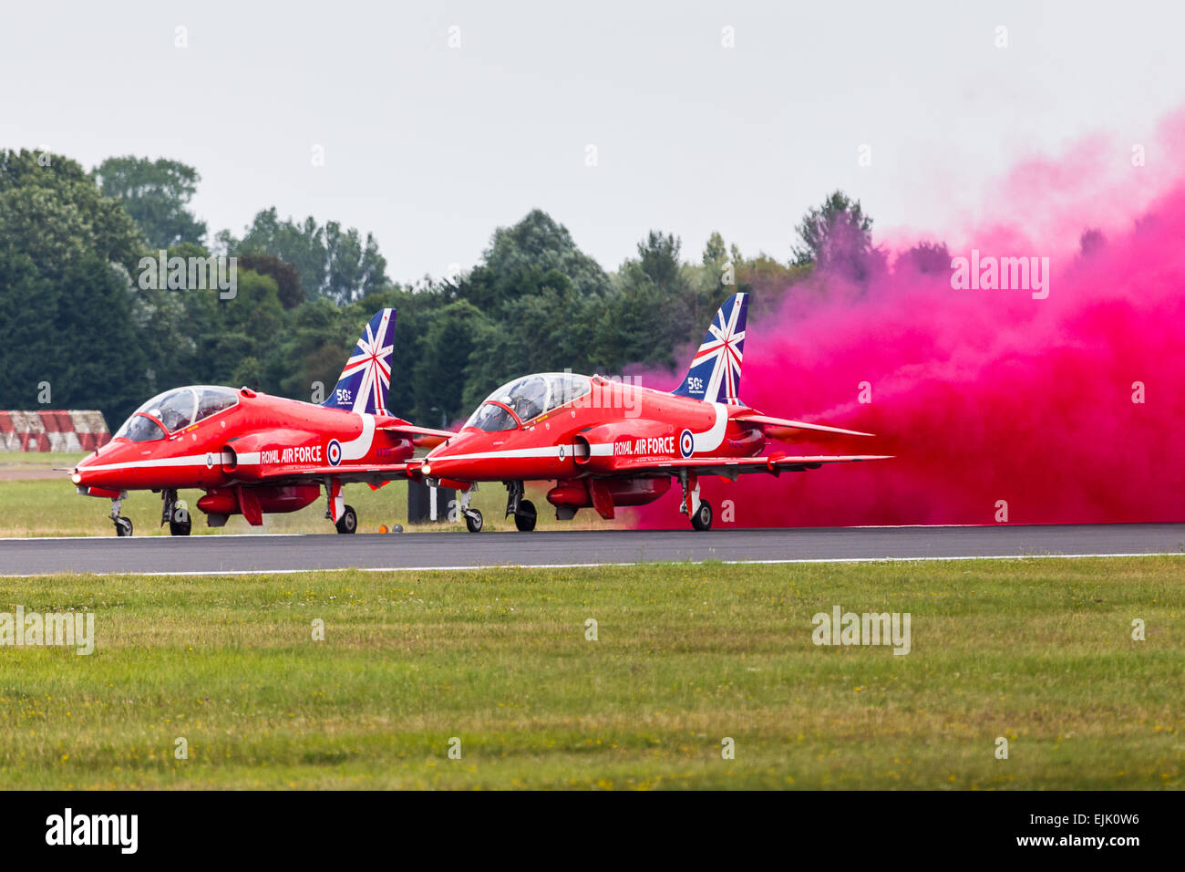 Red Arrows rolling down the runway at RIAT 2014 Stock Photo - Alamy