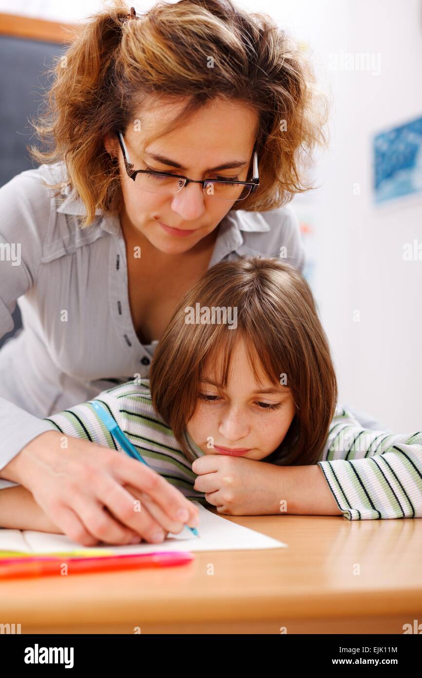 Teacher holding student's hand, to help and show writing Stock Photo ...