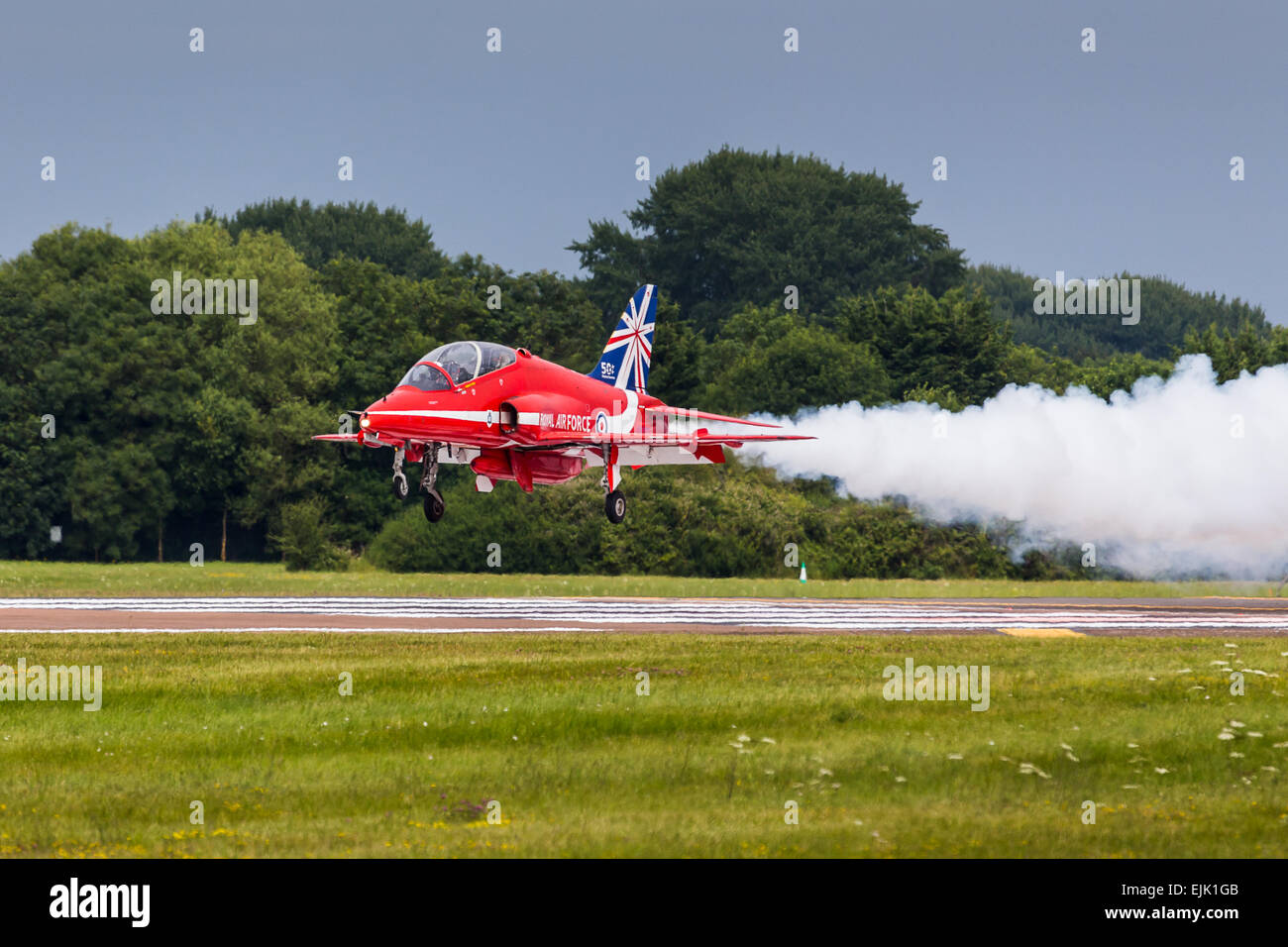 One of the Red Arrows coming into land at RIAT 2014 Stock Photo - Alamy