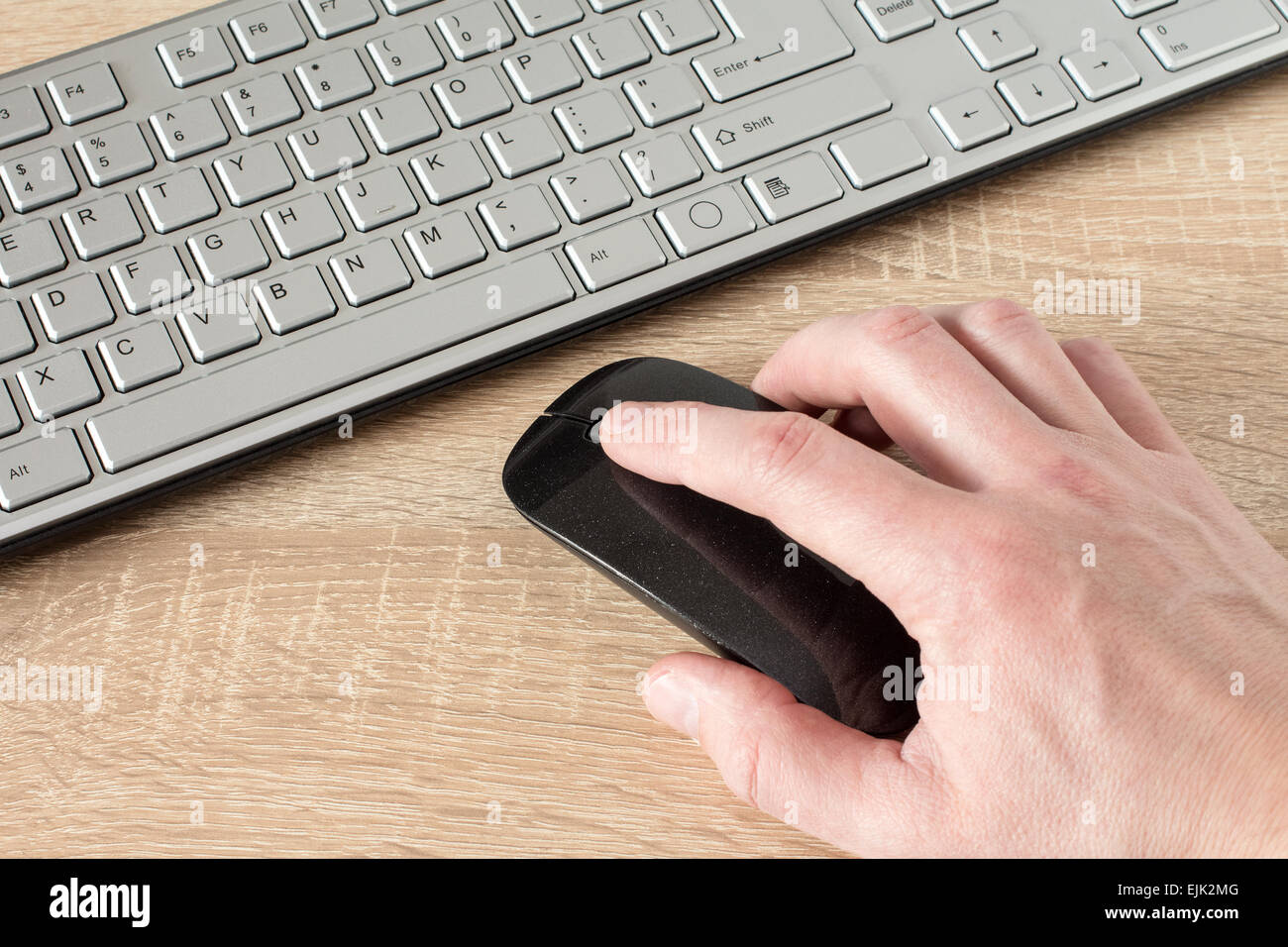 Closeup of hand using wireless computer mouse Stock Photo - Alamy